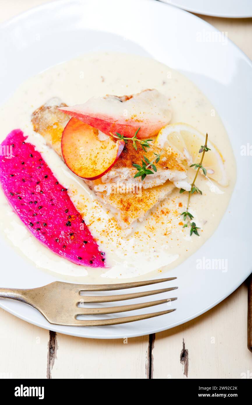 Sea bream orata fillet butter pan fried with fresh peach prune and ...