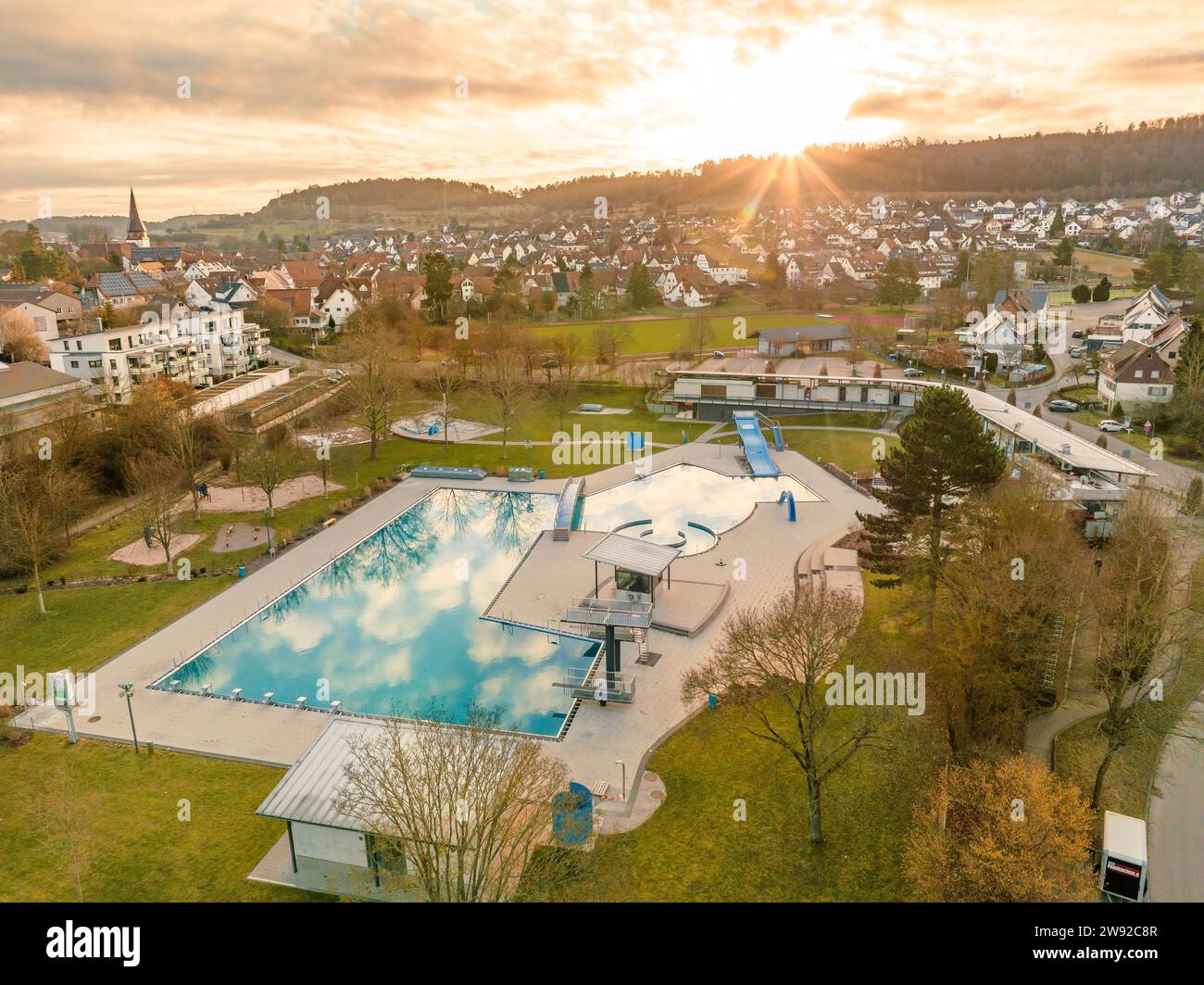 Aerial view of an outdoor pool in the village on a cloudy day with ...