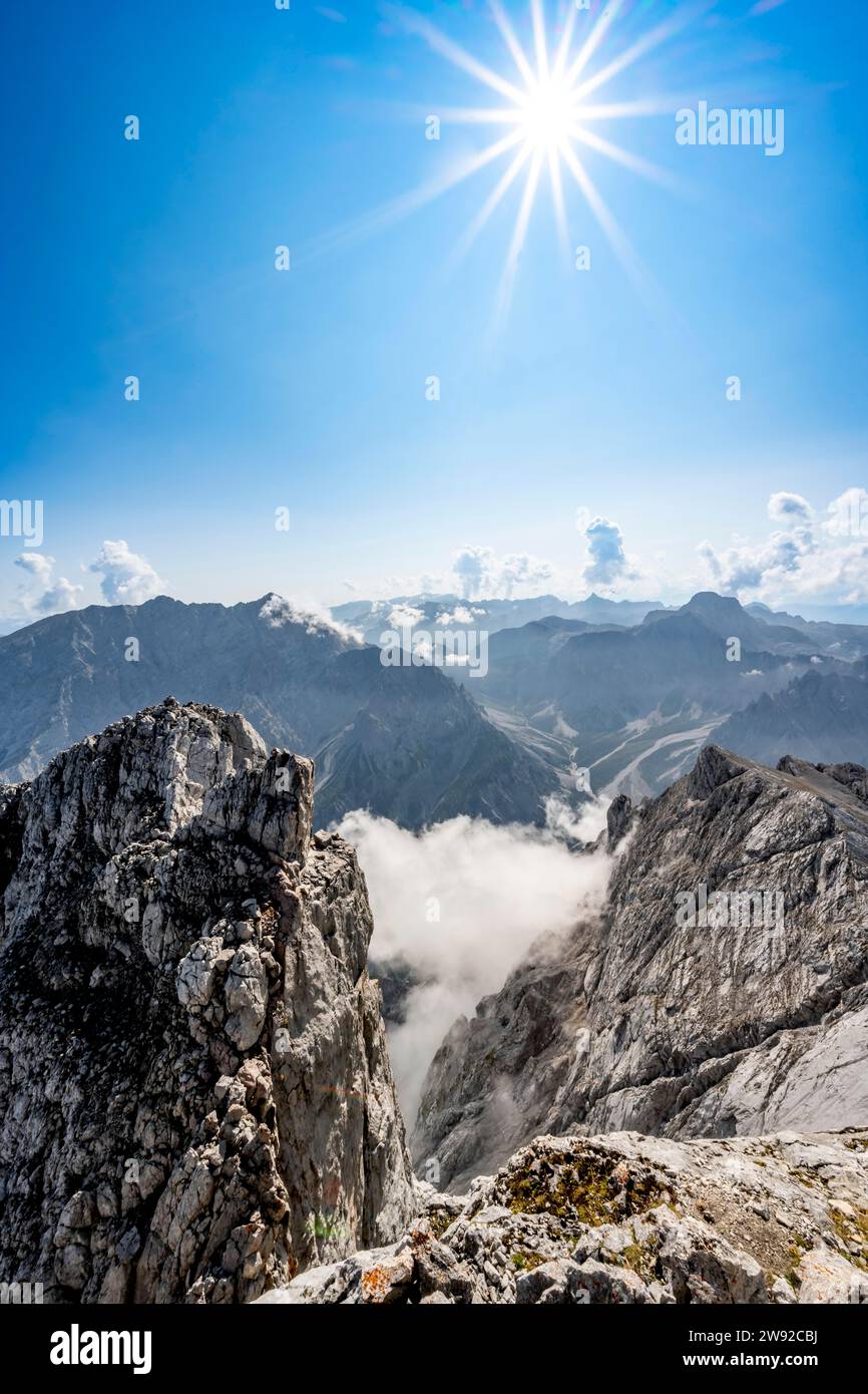 View from the summit of the Hochkalter, rocky steep mountain landscape, behind summit of the ...