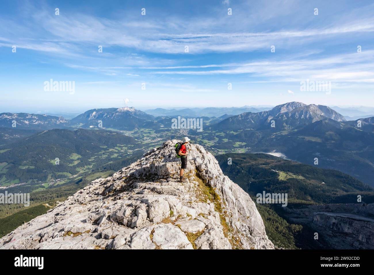 Mountaineer on rocky mountain path to Watzmann Hocheck summit, view of ...