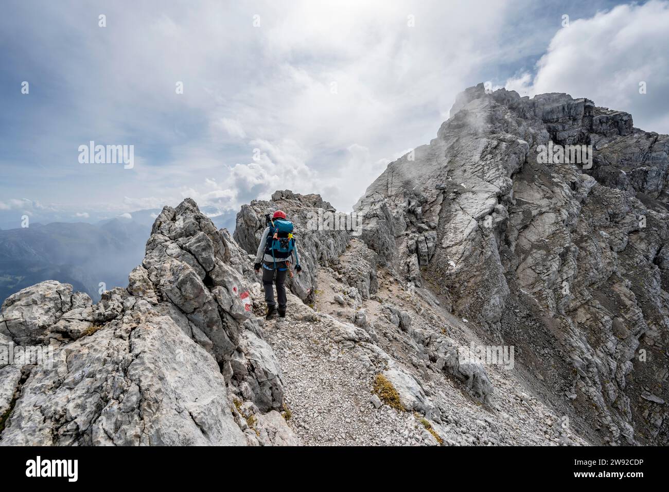 Mountaineer on a narrow rocky ridge, Watzmann crossing to the Watzmann ...