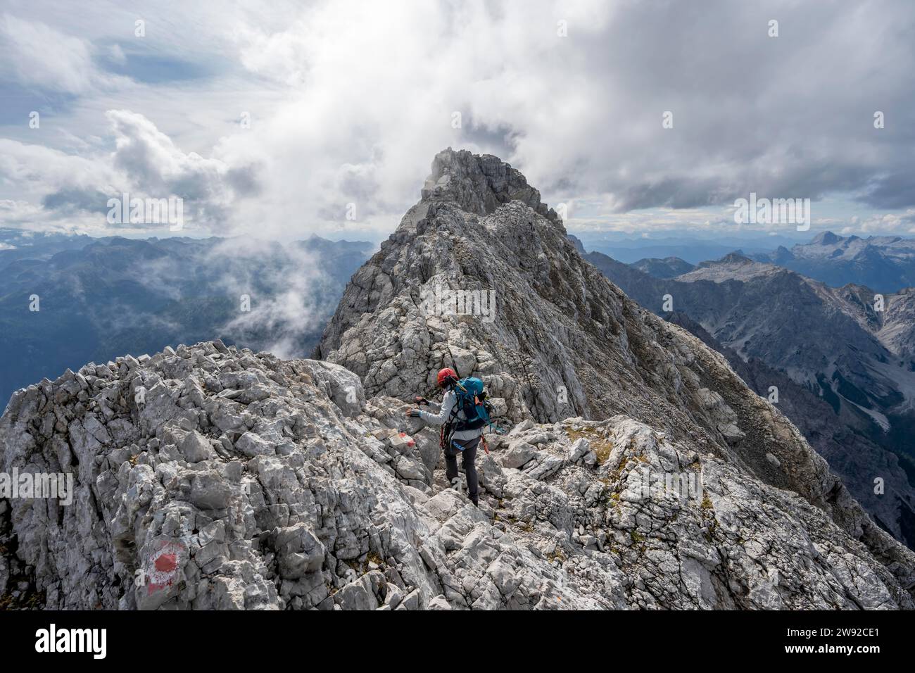 Mountaineer on a narrow rocky ridge, Watzmann crossing to Watzmann ...