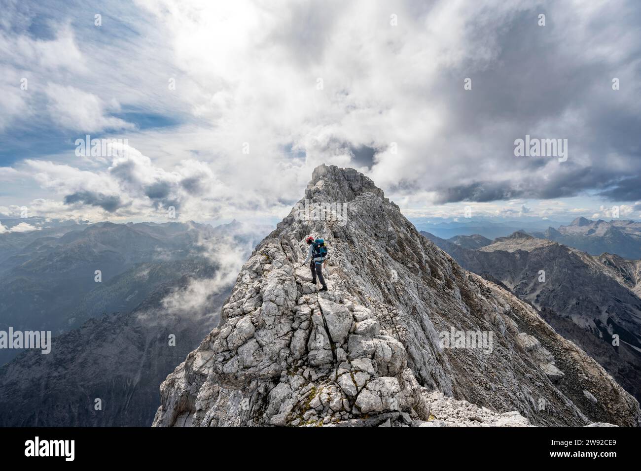 Mountaineer on a narrow rocky ridge, Watzmann crossing to Watzmann ...