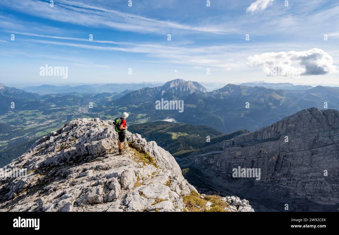 Mountaineer on rocky mountain path to Watzmann Hocheck summit, view of ...