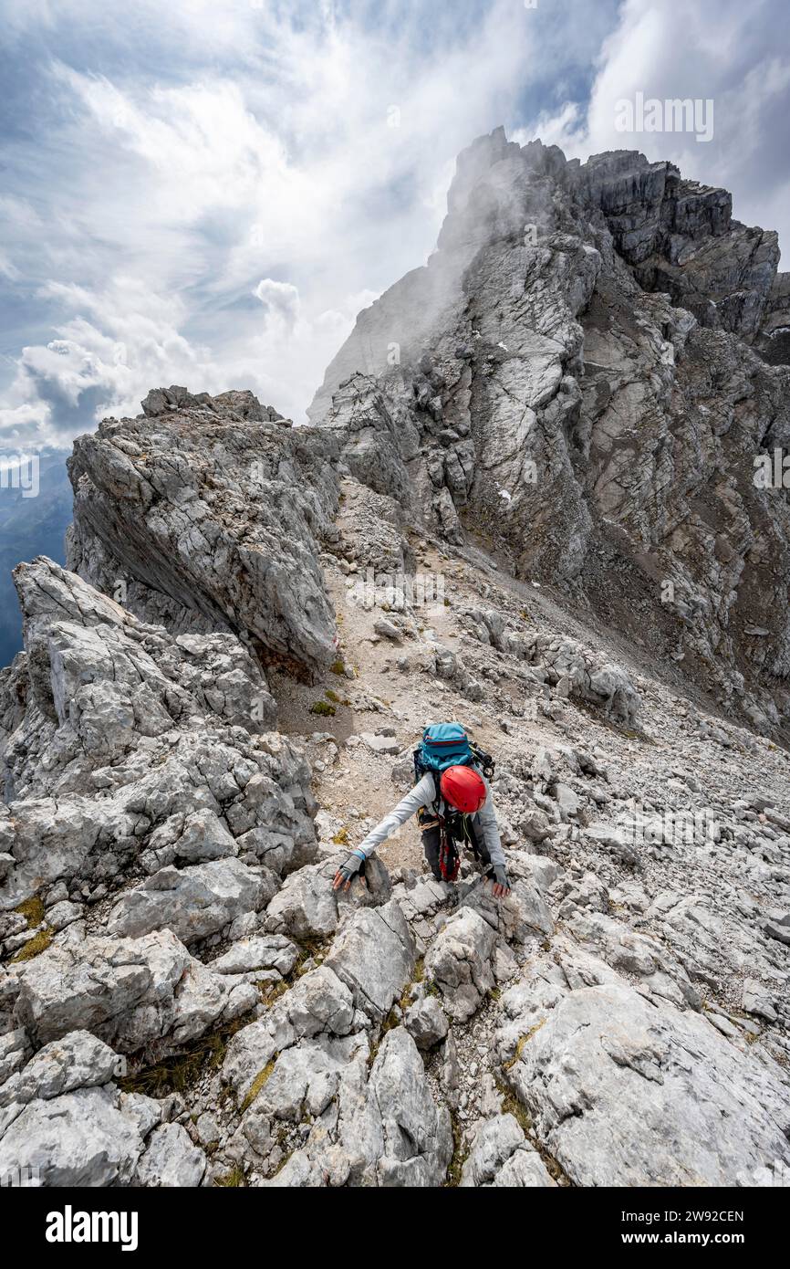 Mountaineer climbing on a narrow rocky ridge, Watzmann crossing to the ...