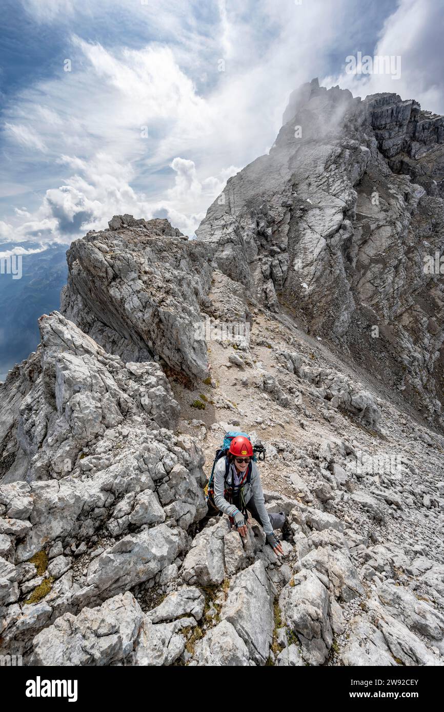 Mountaineer climbing on a narrow rocky ridge, Watzmann crossing to the ...
