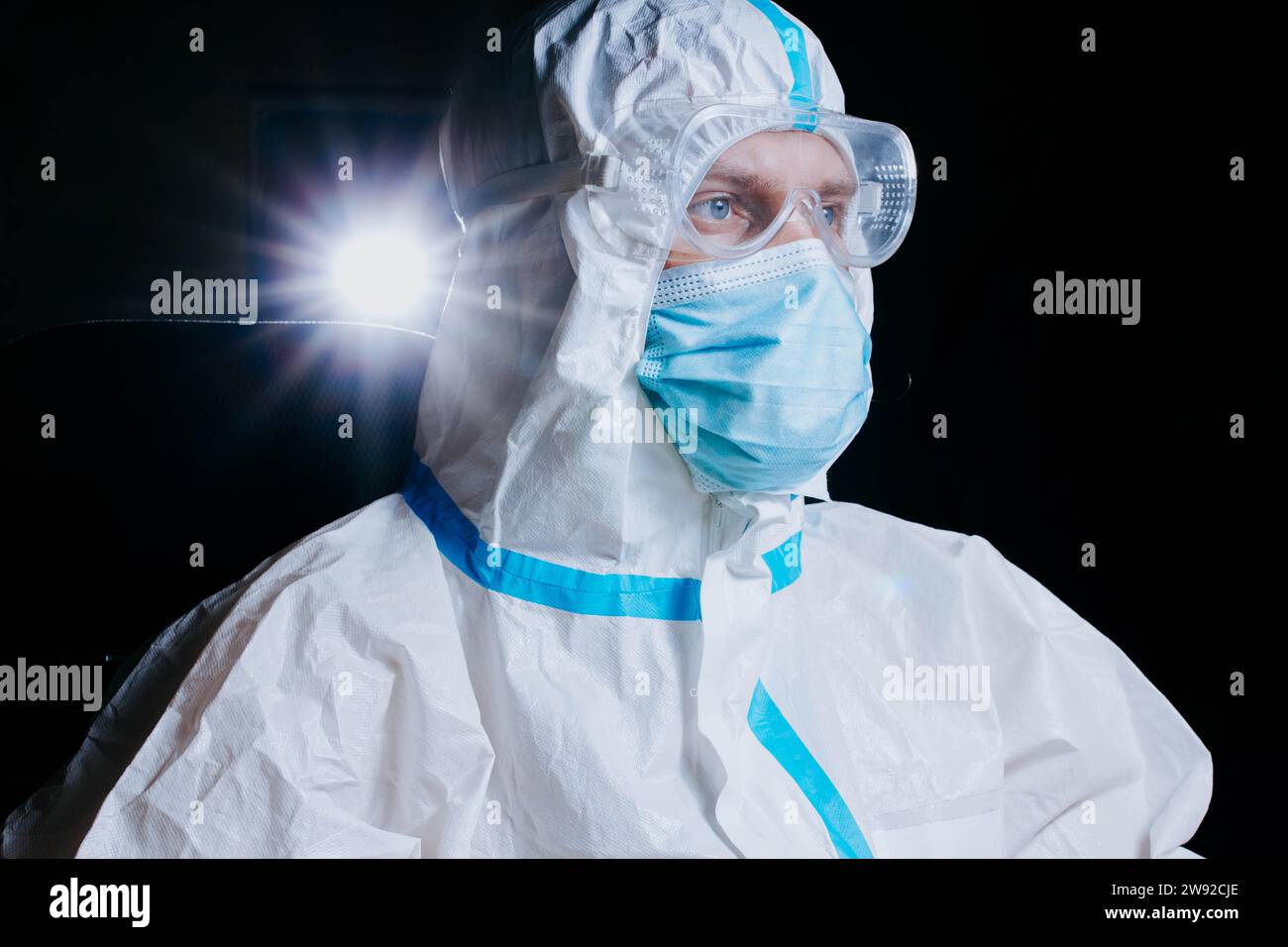 Doctor laboratory assistant in personal protective equipment against ...