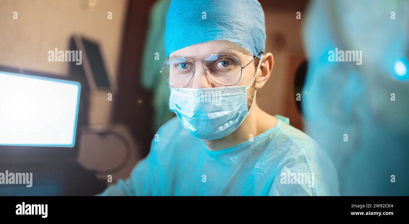 Portrait of a young professional surgeon, In the background is a ...