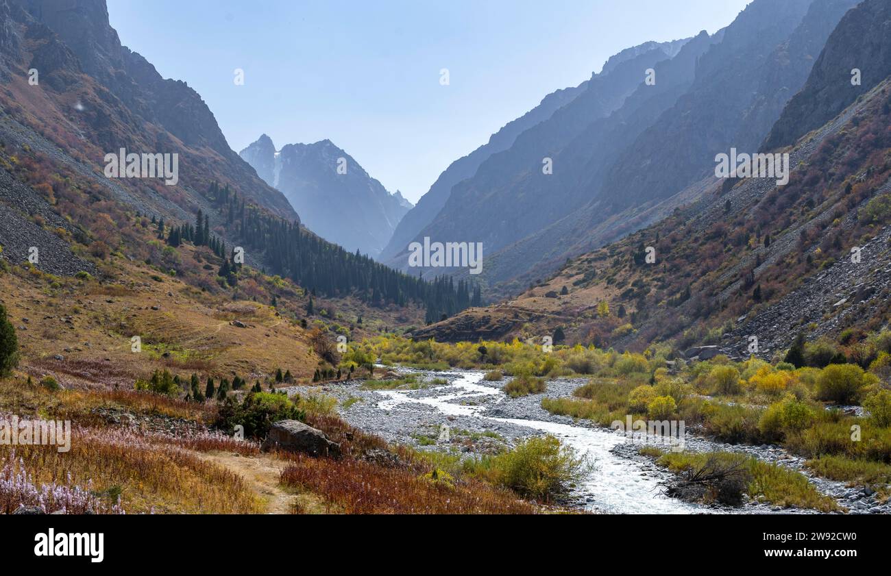 Mountain stream Ala Archa flows through the Ala Archa valley, autumnal ...