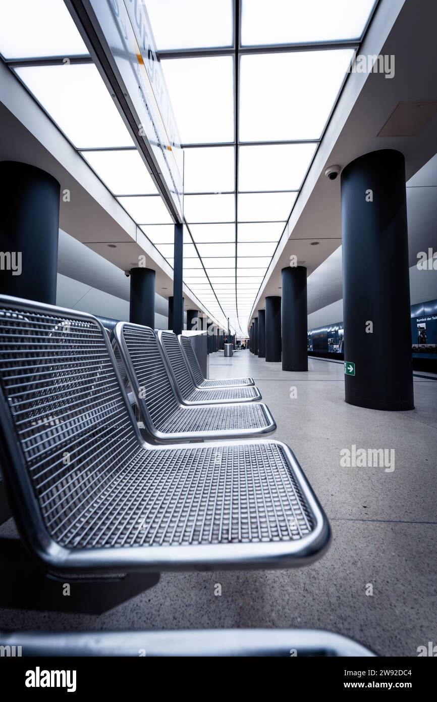 Interior public transport waiting area with benches and modern ...