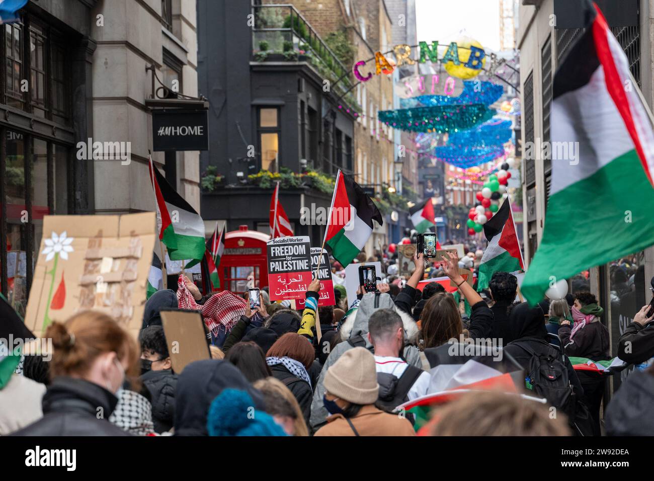 London / UK 23 DEC 2023. Hundreds of people demonstrated in Carnaby ...