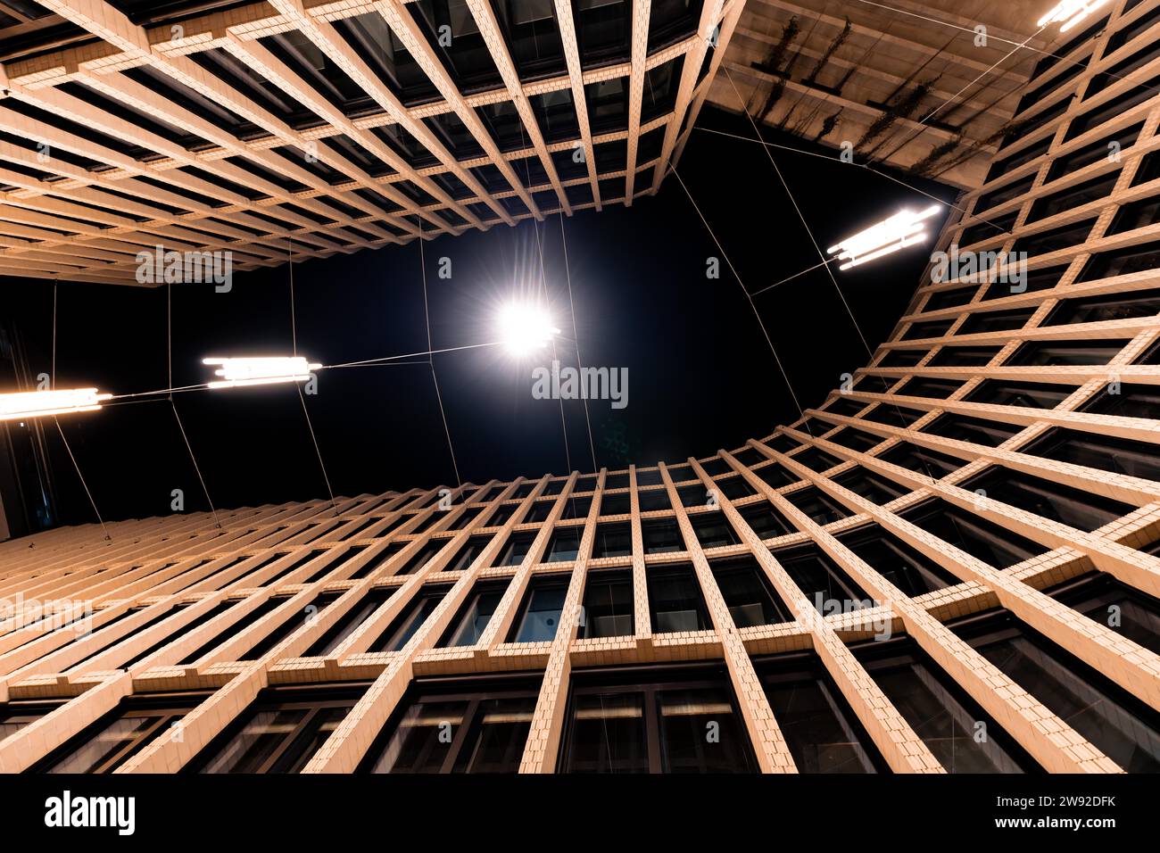 Interior view of a circular building structure with lighting from above ...