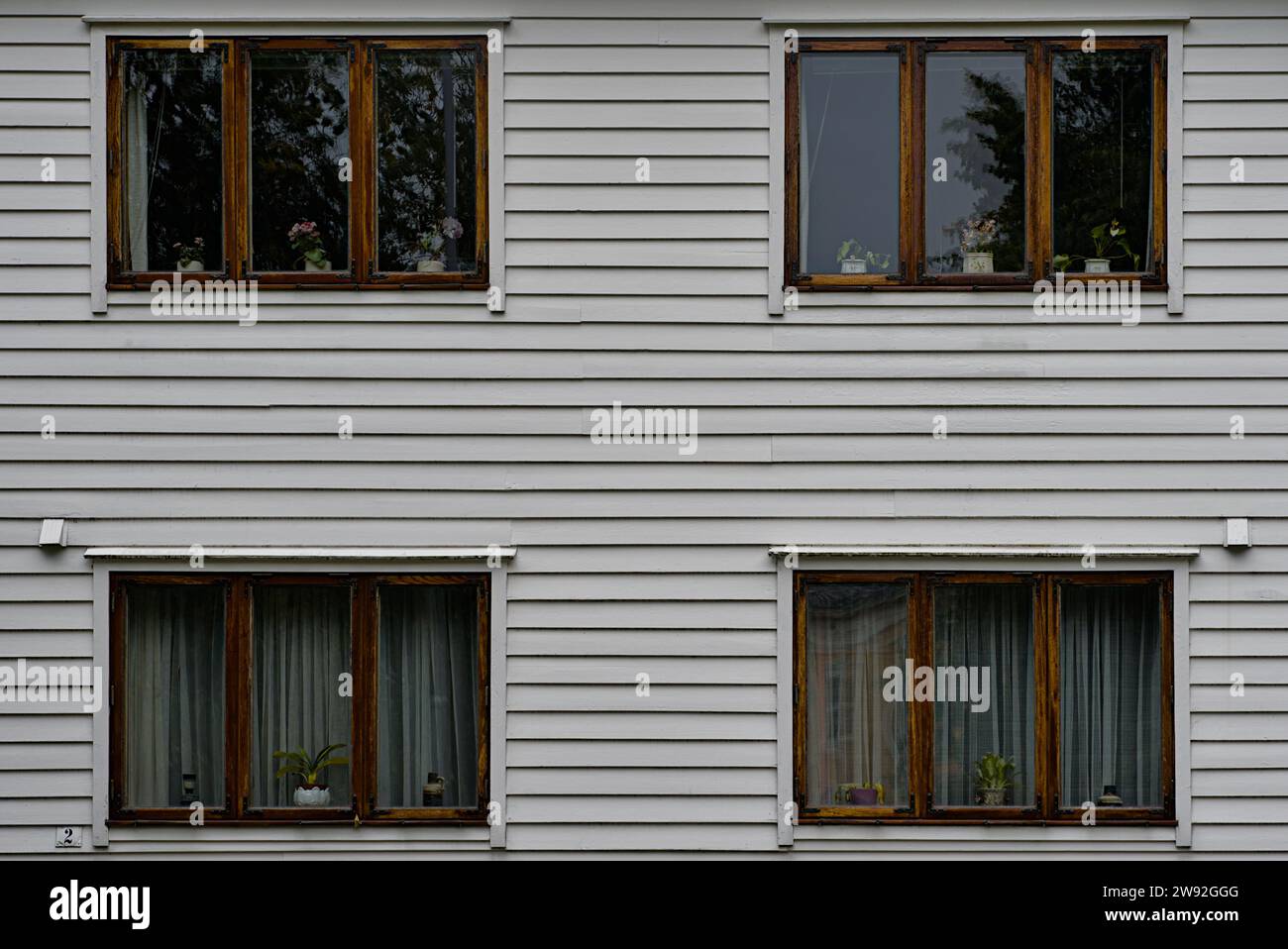Four symmetry windows on a house in Bergen, Norway Stock Photo - Alamy