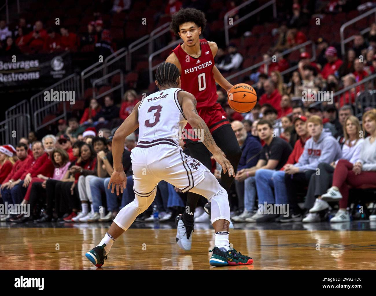 Rutgers Scarlet Knights guard Derek Simpson (0) is defended by ...