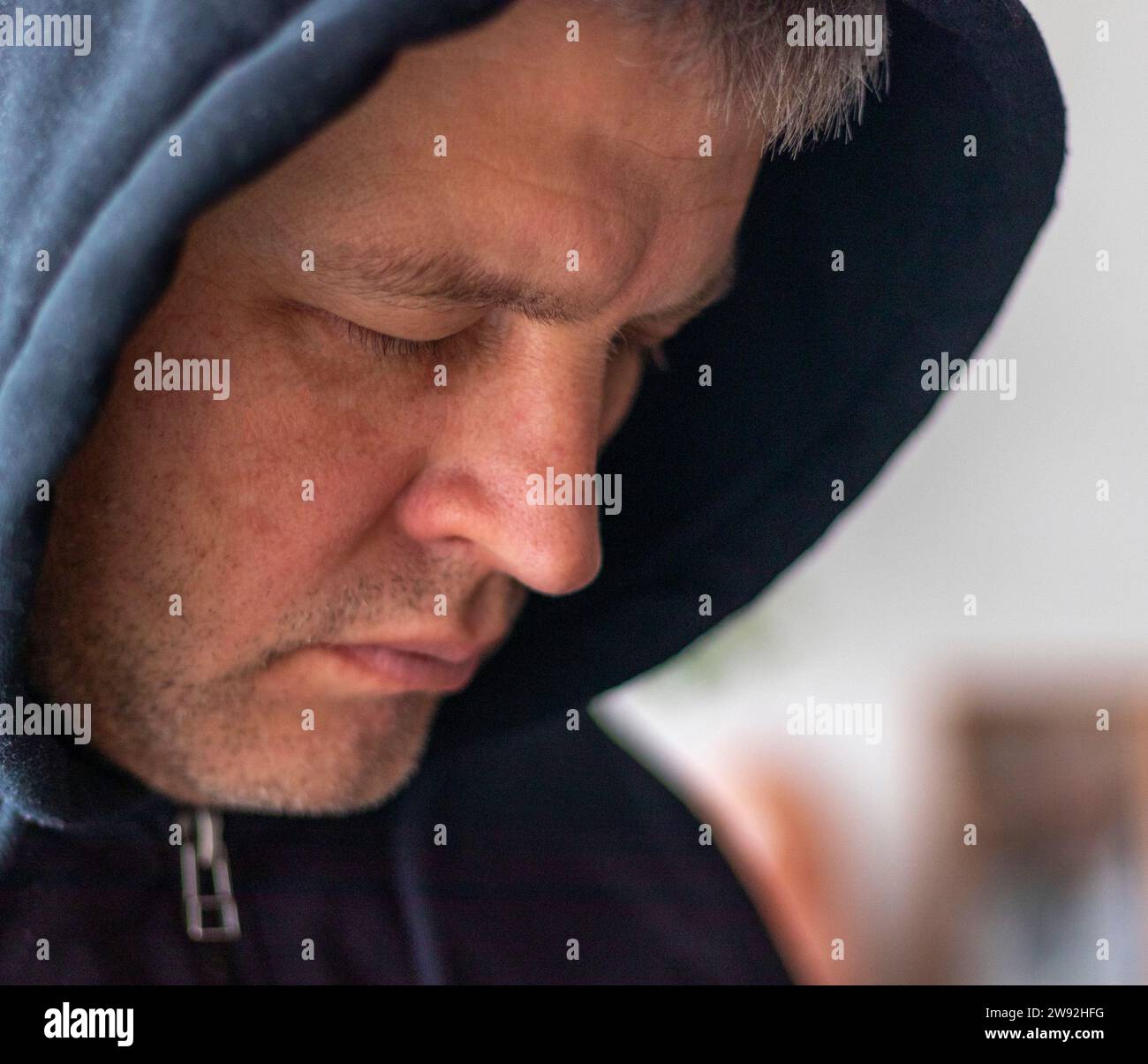 Man looked like hacker in a hood looking at the screen Stock Photo - Alamy