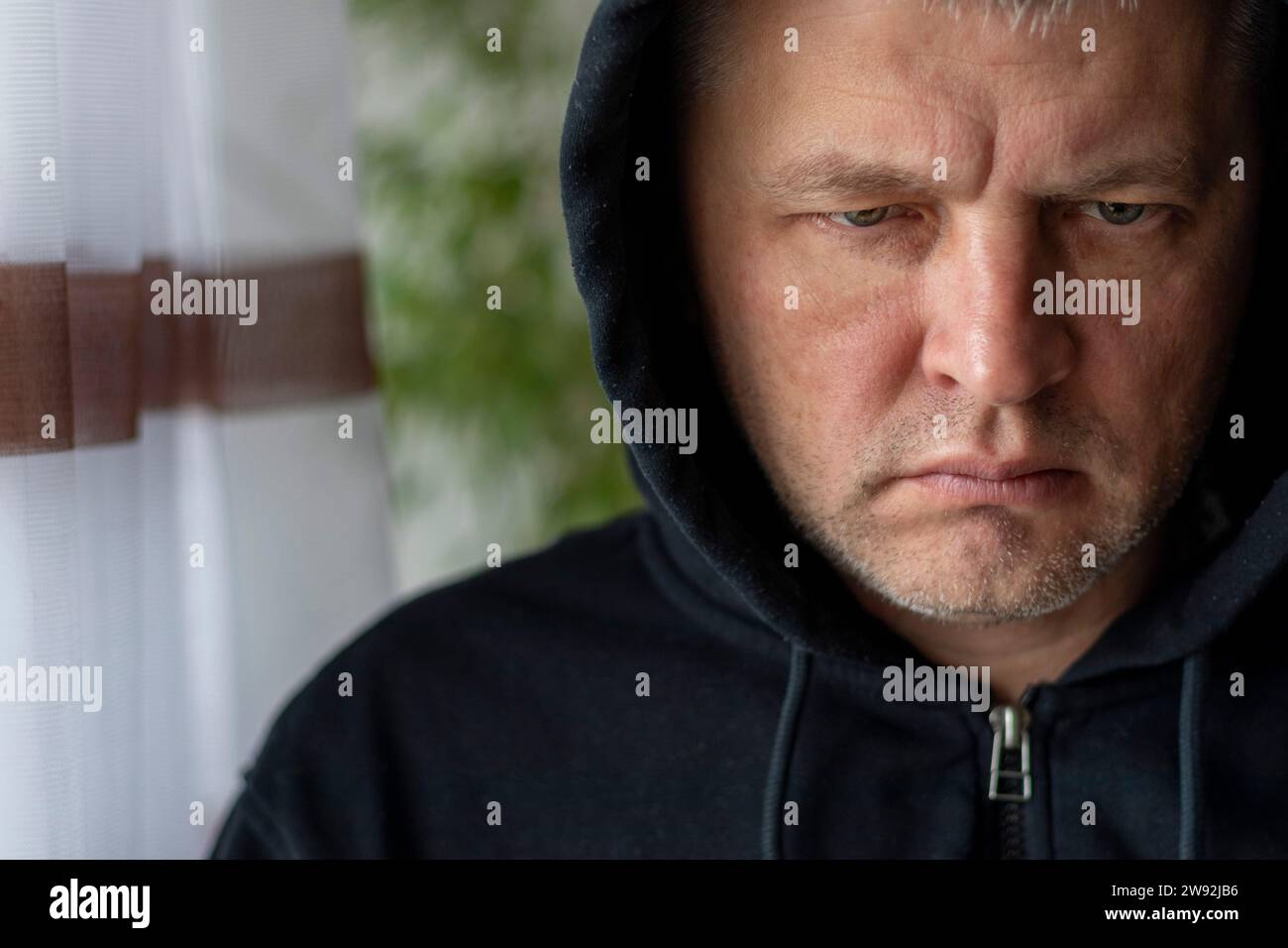 Man looked like hacker in a hood looking at the screen Stock Photo - Alamy