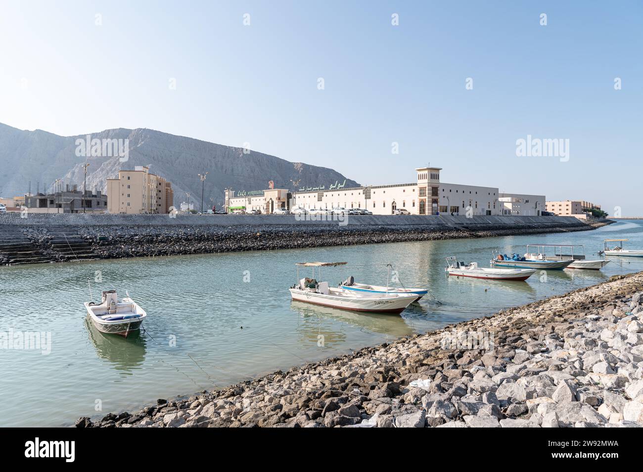 Boats moored at the end of the eastern Sea Canal with Lulu supermarket ...
