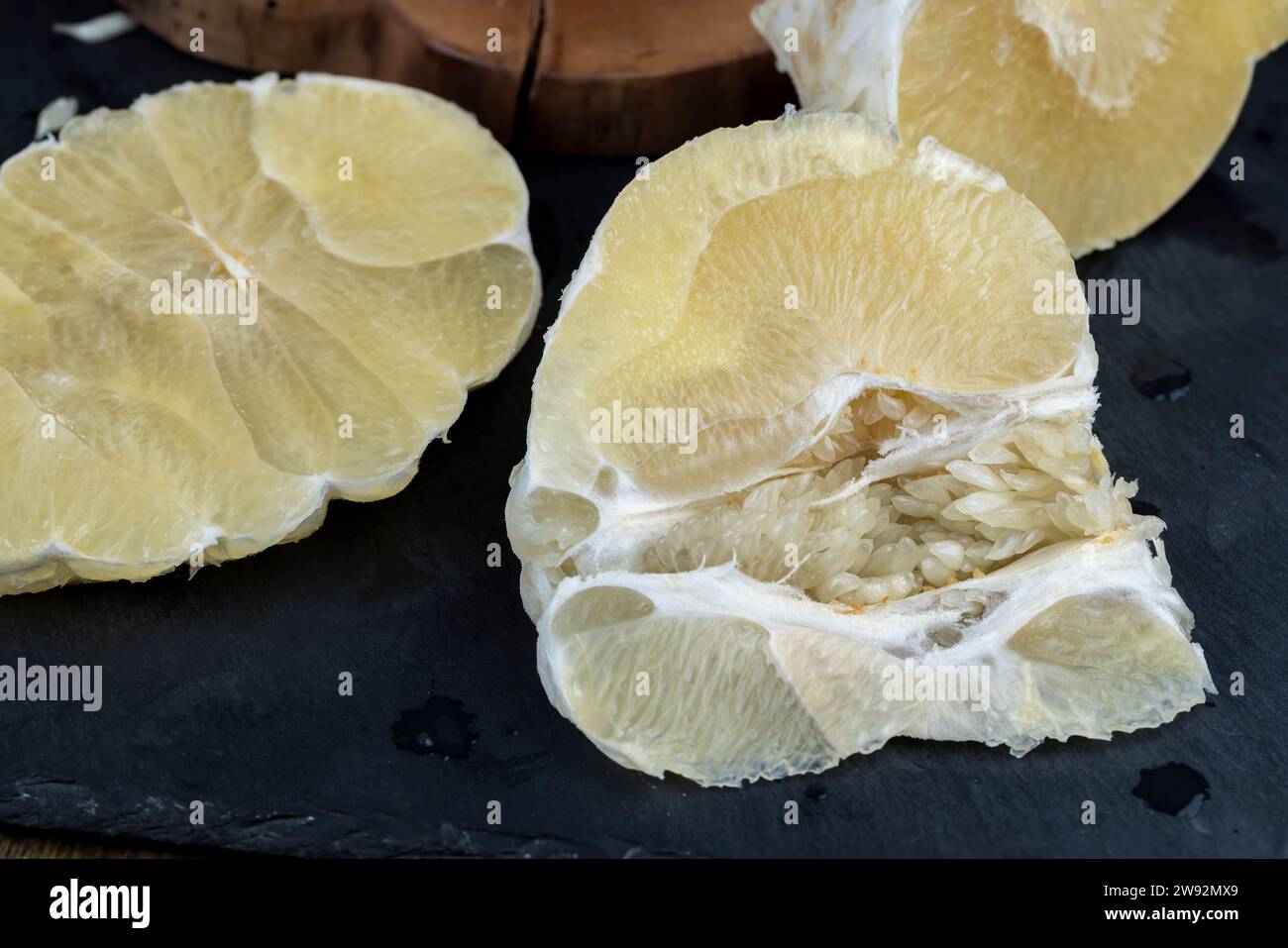 cut into pieces of ripe juicy yellow pomelo, divided into parts large ...