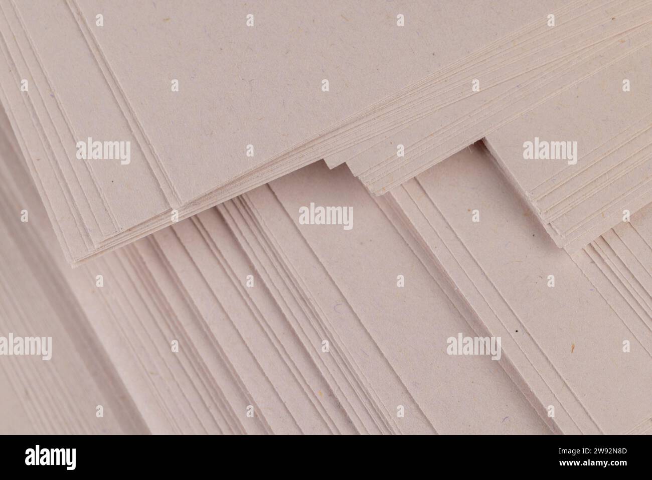 grey low-quality thin paper from recycled waste, paper used for writing ...