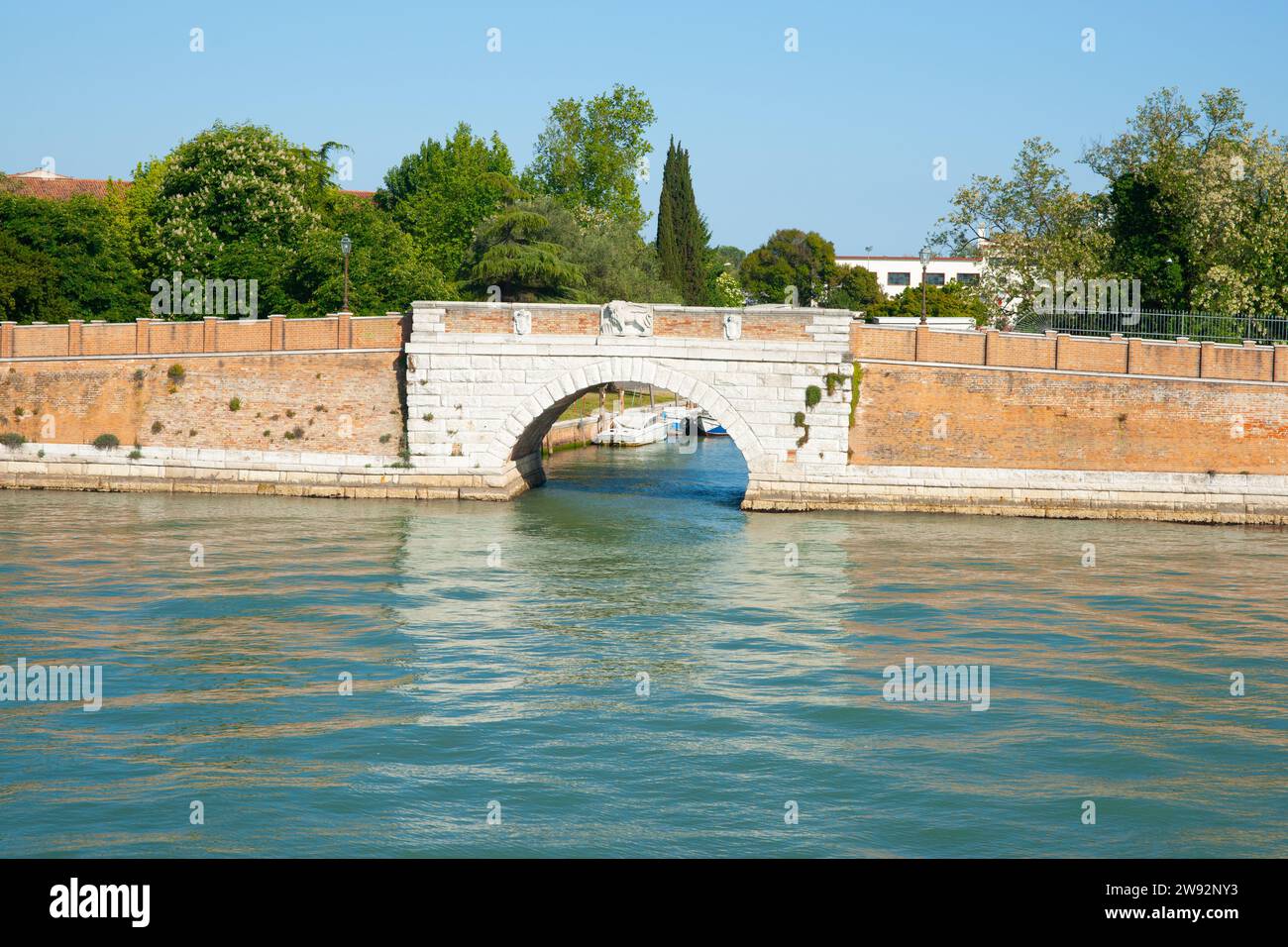Low Brick arch bridge with lion on island of Lido, Venice Stock Photo ...