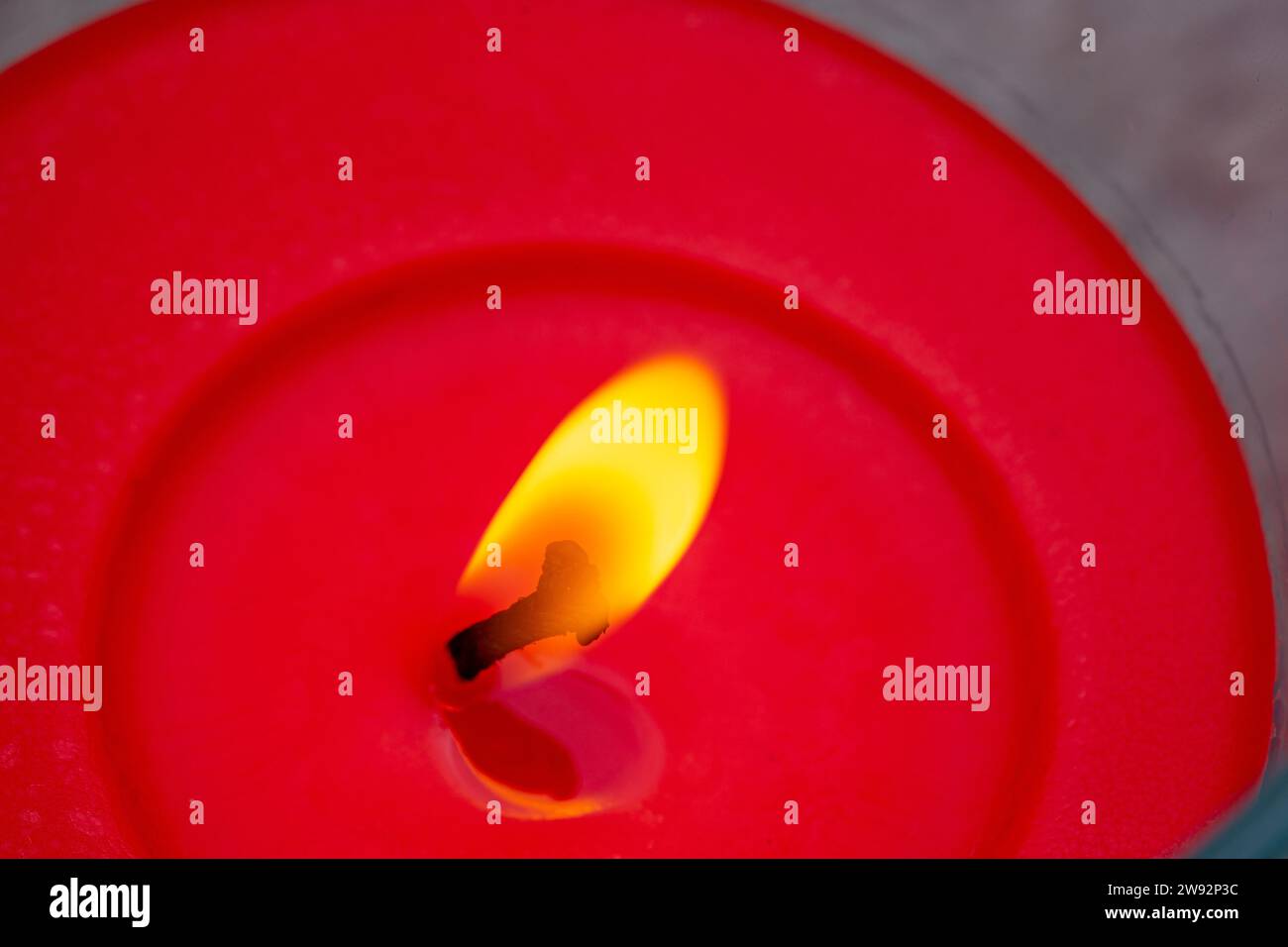 red wax candle with burning flame Stock Photo - Alamy