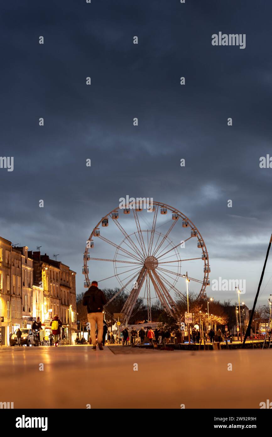 Cityscape of La rochelle with towers and great wheel, France. night ...