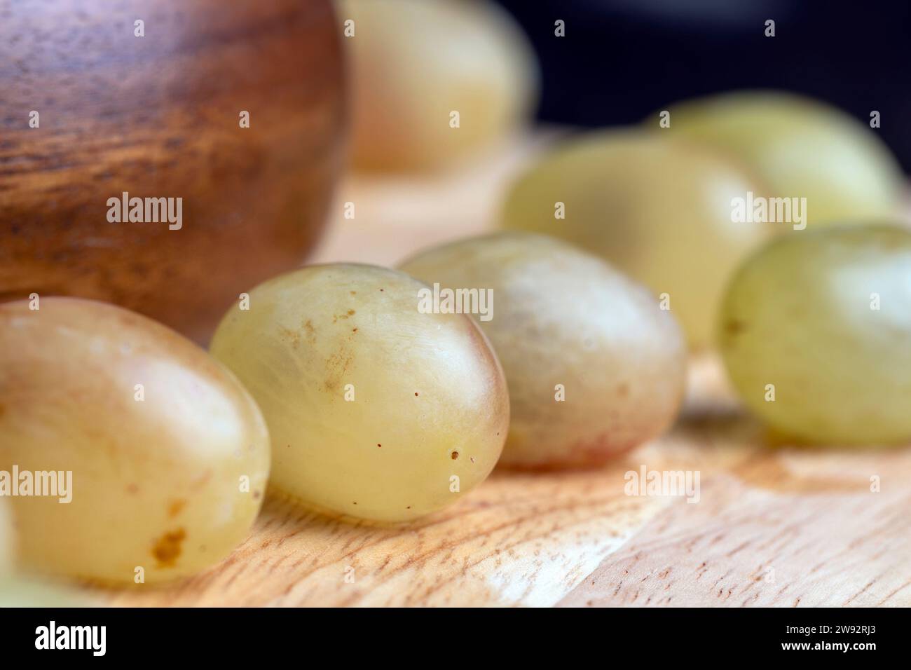 Homemade green unwashed grapes on a board, fresh harvest of yellow ...