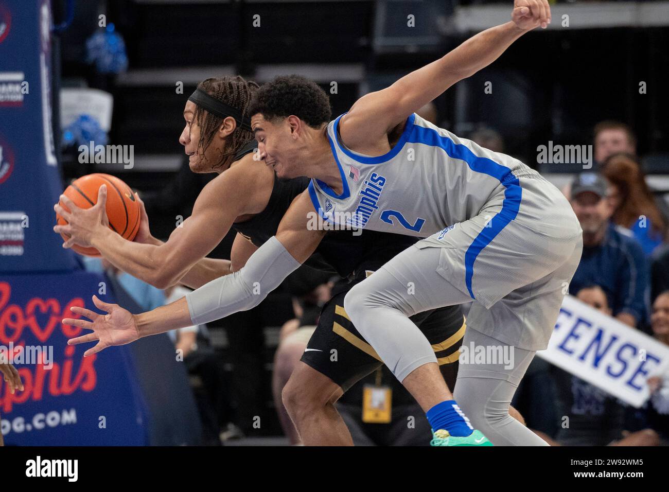 Vanderbilt guard Jordan Williams, back, drives to the basket defended ...