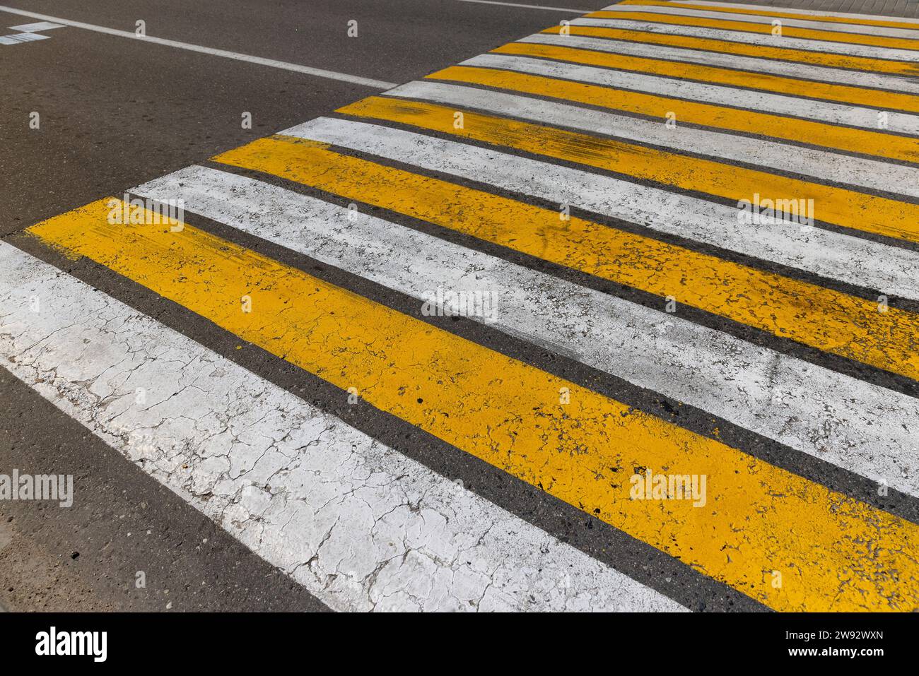 white and yellow pedestrian crossing on the road, pedestrian crossing ...
