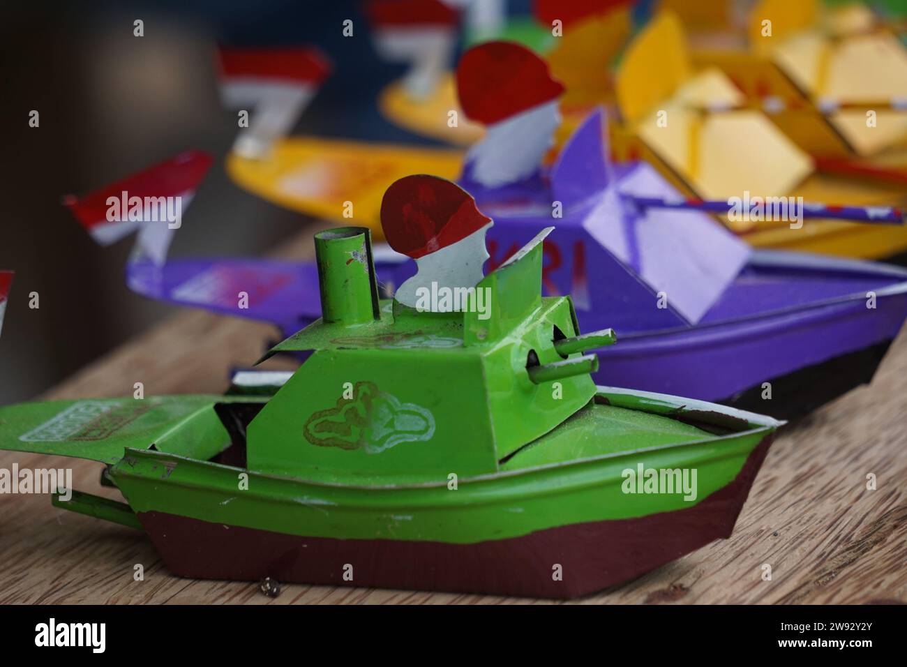 Colorful toys boat with navy on natural background Stock Photo - Alamy