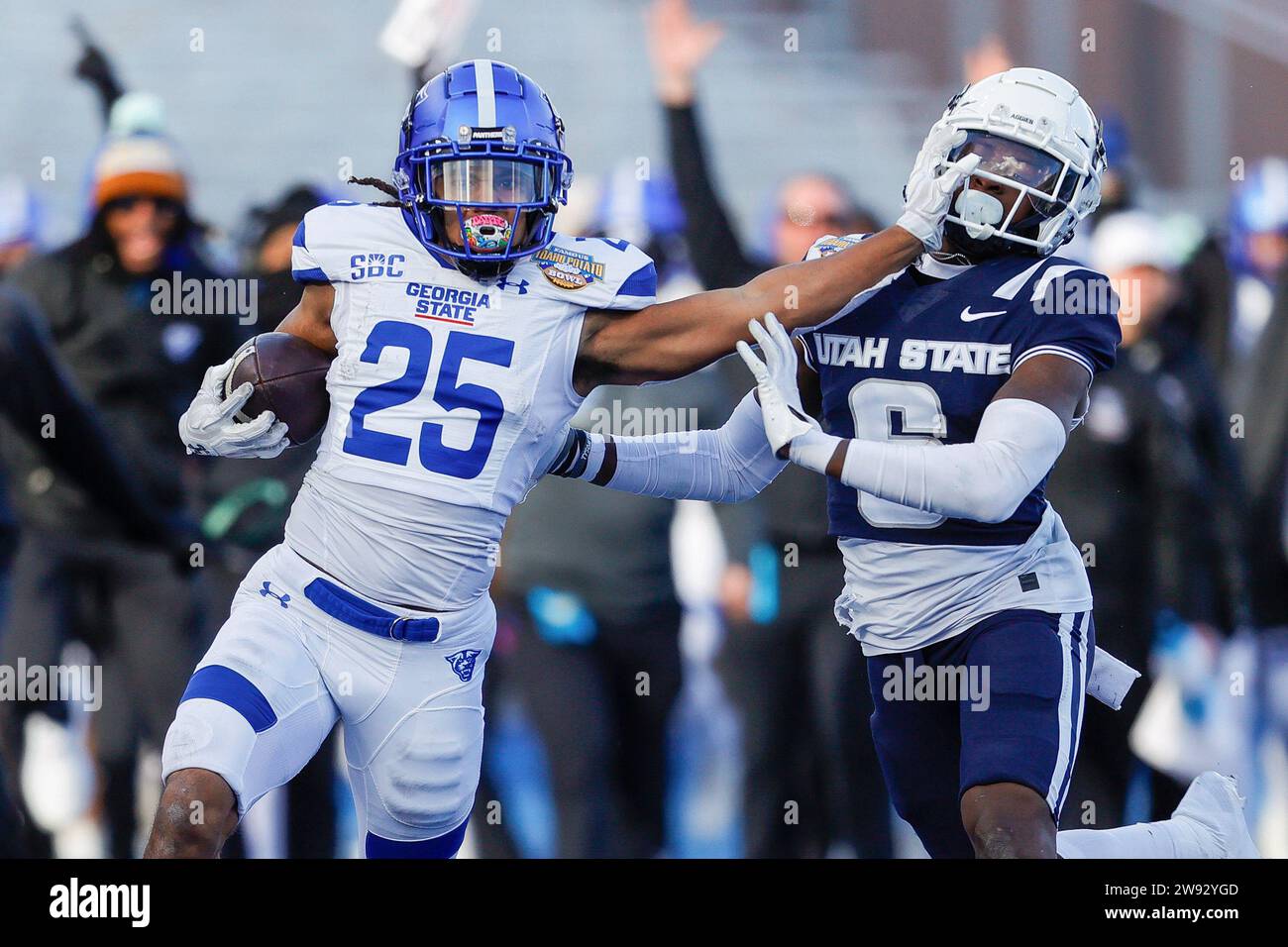 Georgia State running back Freddie Brock (25) stiff arms Utah State ...