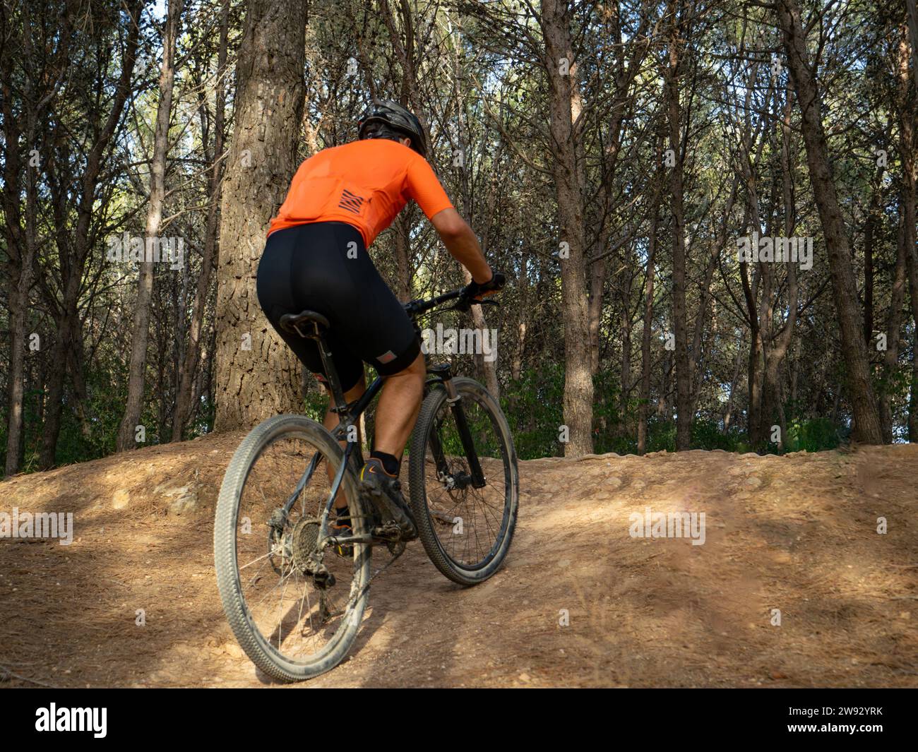 Man pedaling a bicycle hi-res stock photography and images - Alamy