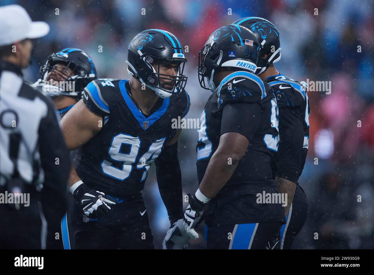 Carolina Panthers defensive end Henry Anderson (94) leans in to hear ...