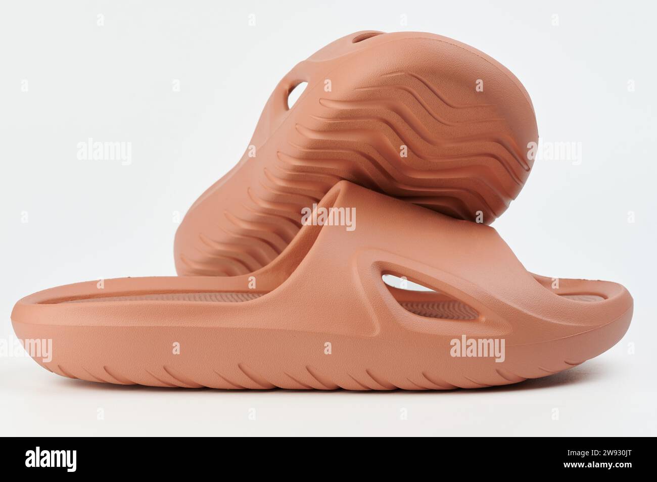 Pair of flip flop on top of each other isolated on studio background ...