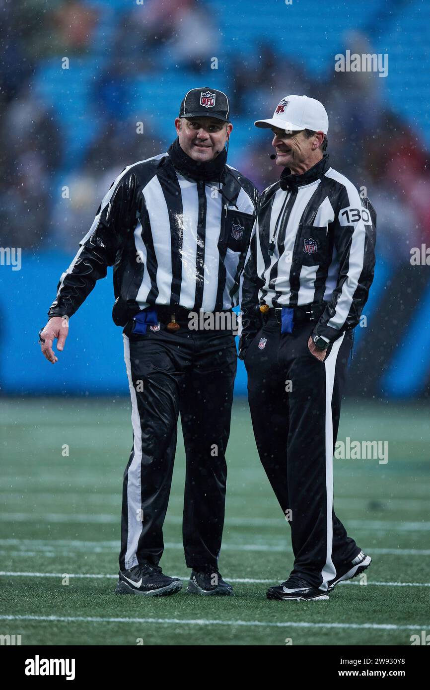 Referee Land Clark (130) smiles during a conversation with back judge ...