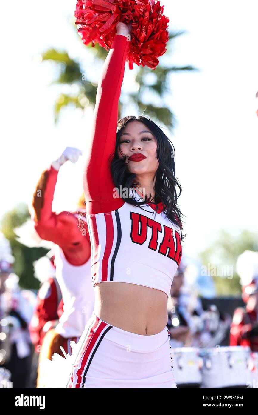 December 23, 2023: A Utah Utes cheerleader performs inside the fan fest ...
