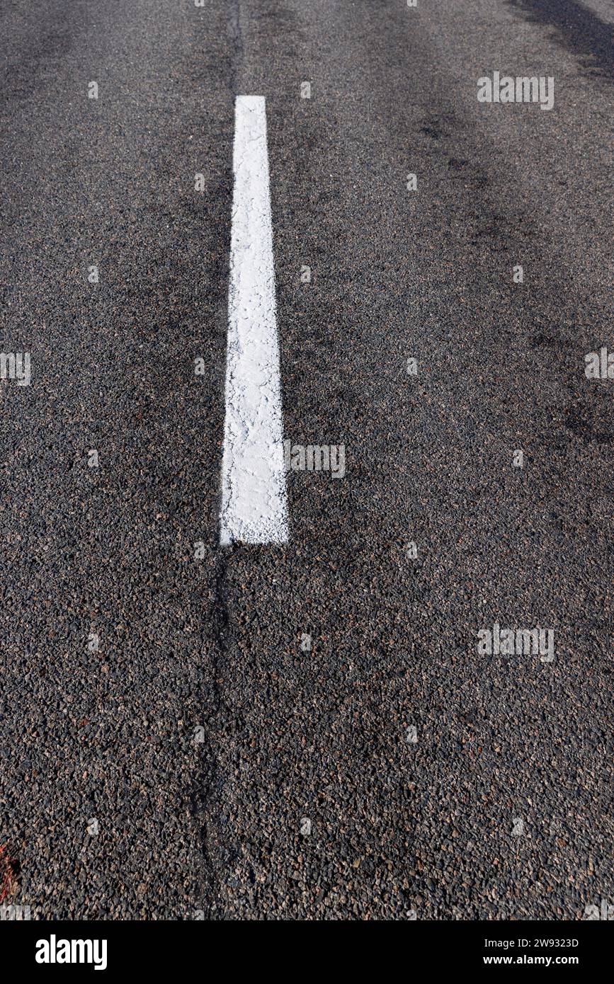 asphalting a new highway with black new asphalt, a close-up of a part ...