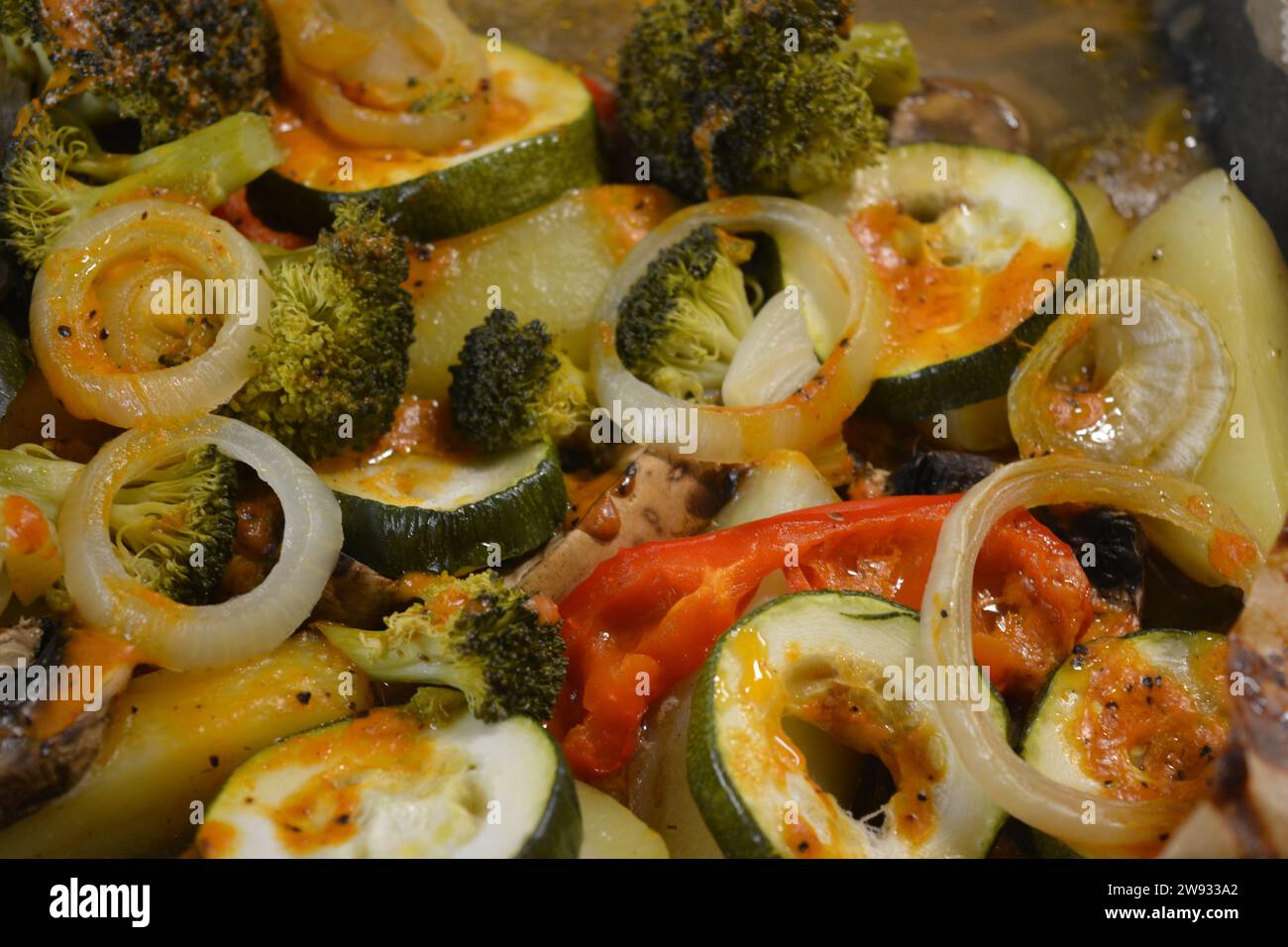 Delicious food, potato wedges with healthy vegetables, rings of chopped ...