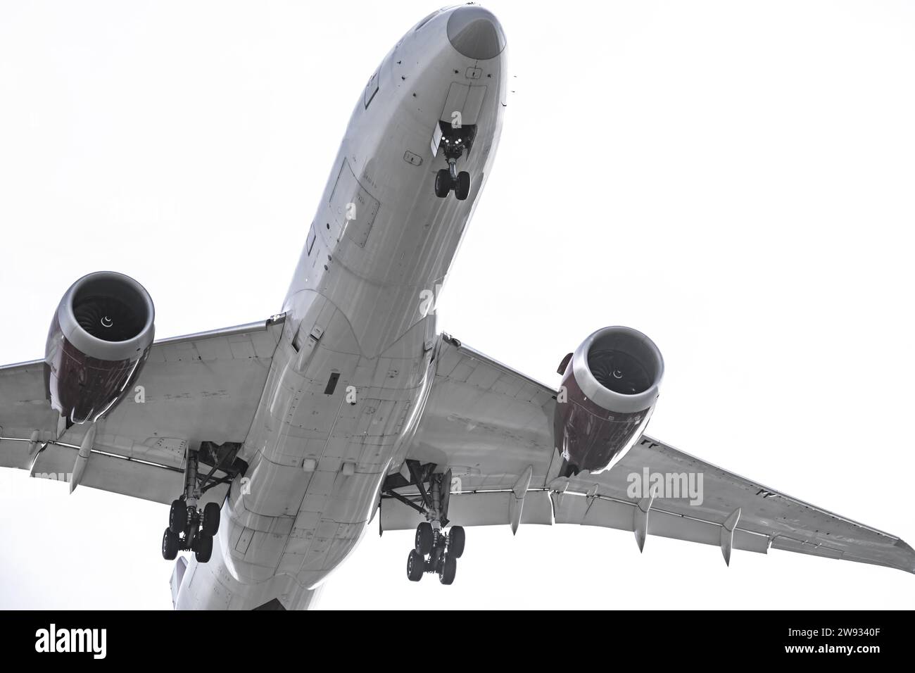 Fuselage seen from below of a large airplane with the landing gear ...