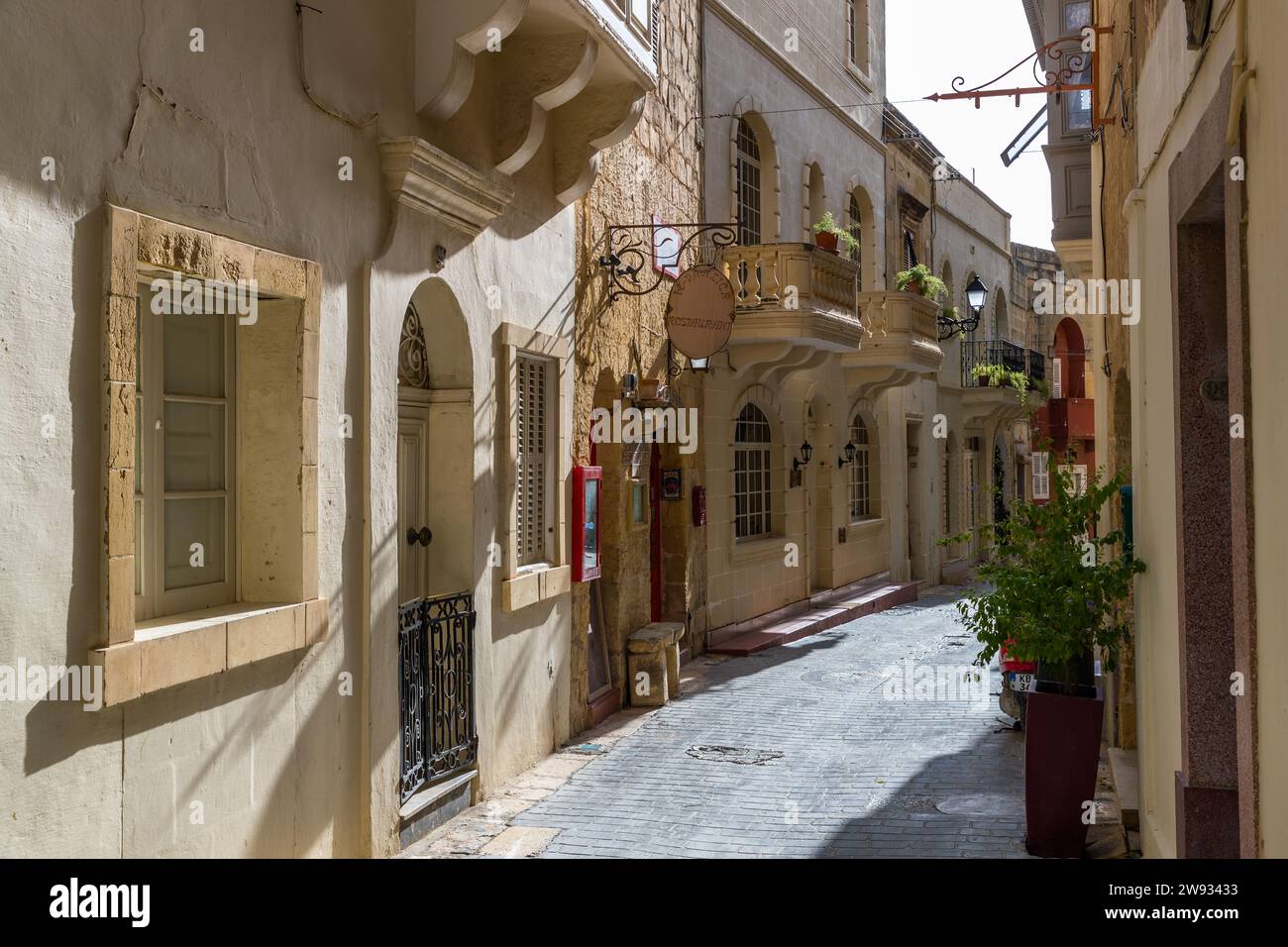 Alley in Victoria, the capital of Gozo, with typical balconies. In the ...