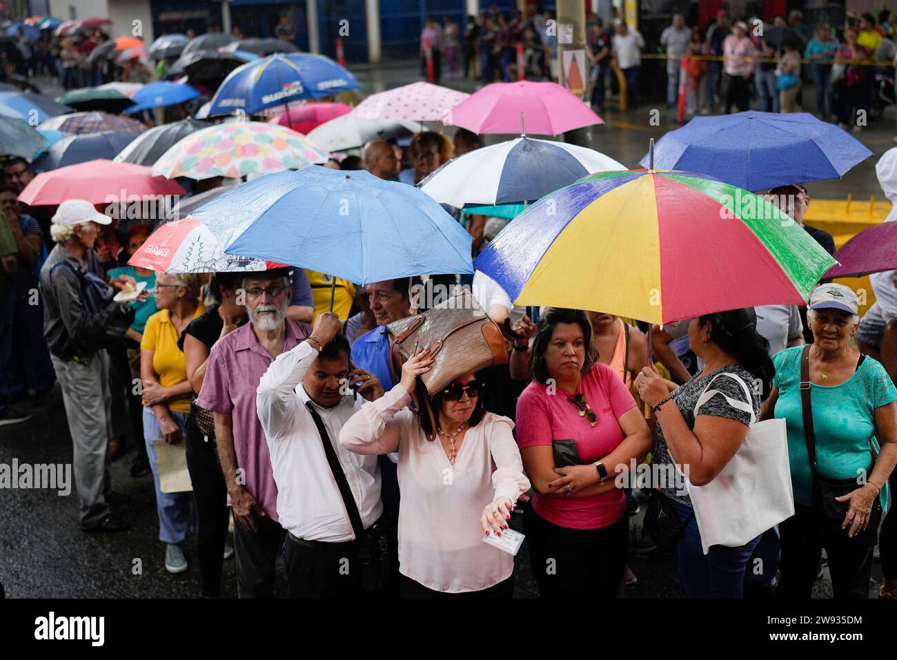 People line up to vote in the opposition primary election that was ...