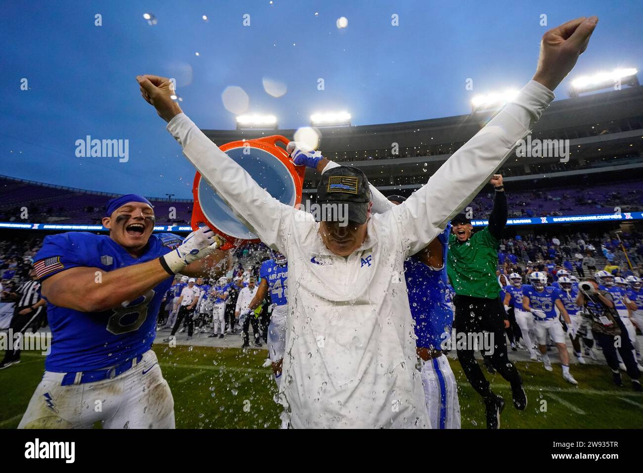 Air Force head coach Troy Calhoun is doused by linebacker Bo Richter ...