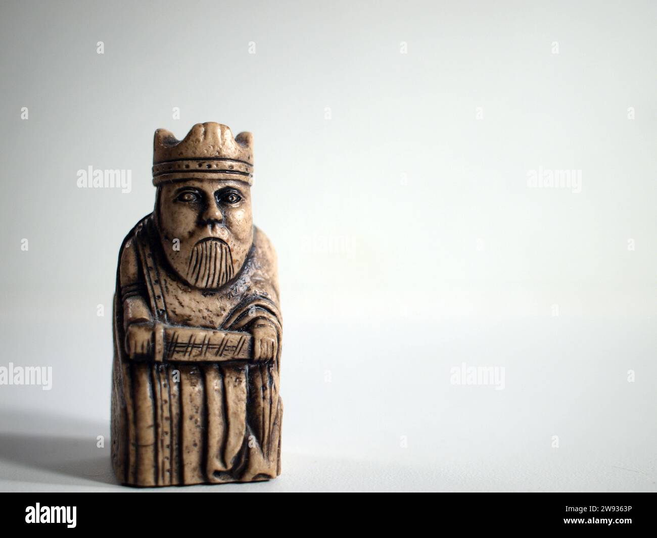 Lone piece of a chess king on a white background. Copy space on the ...