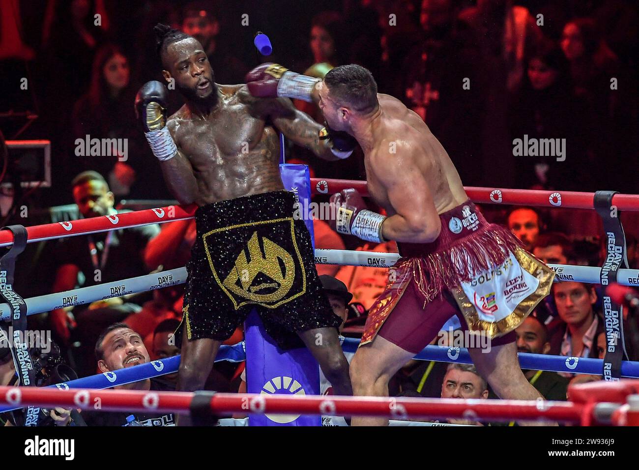 Joseph Parker throws a punch at Deontay Wilder during their boxing ...