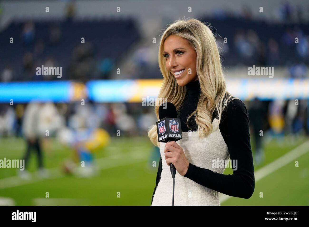 NFL Network reporter Taylor Bisciotti works on the sideline before an ...