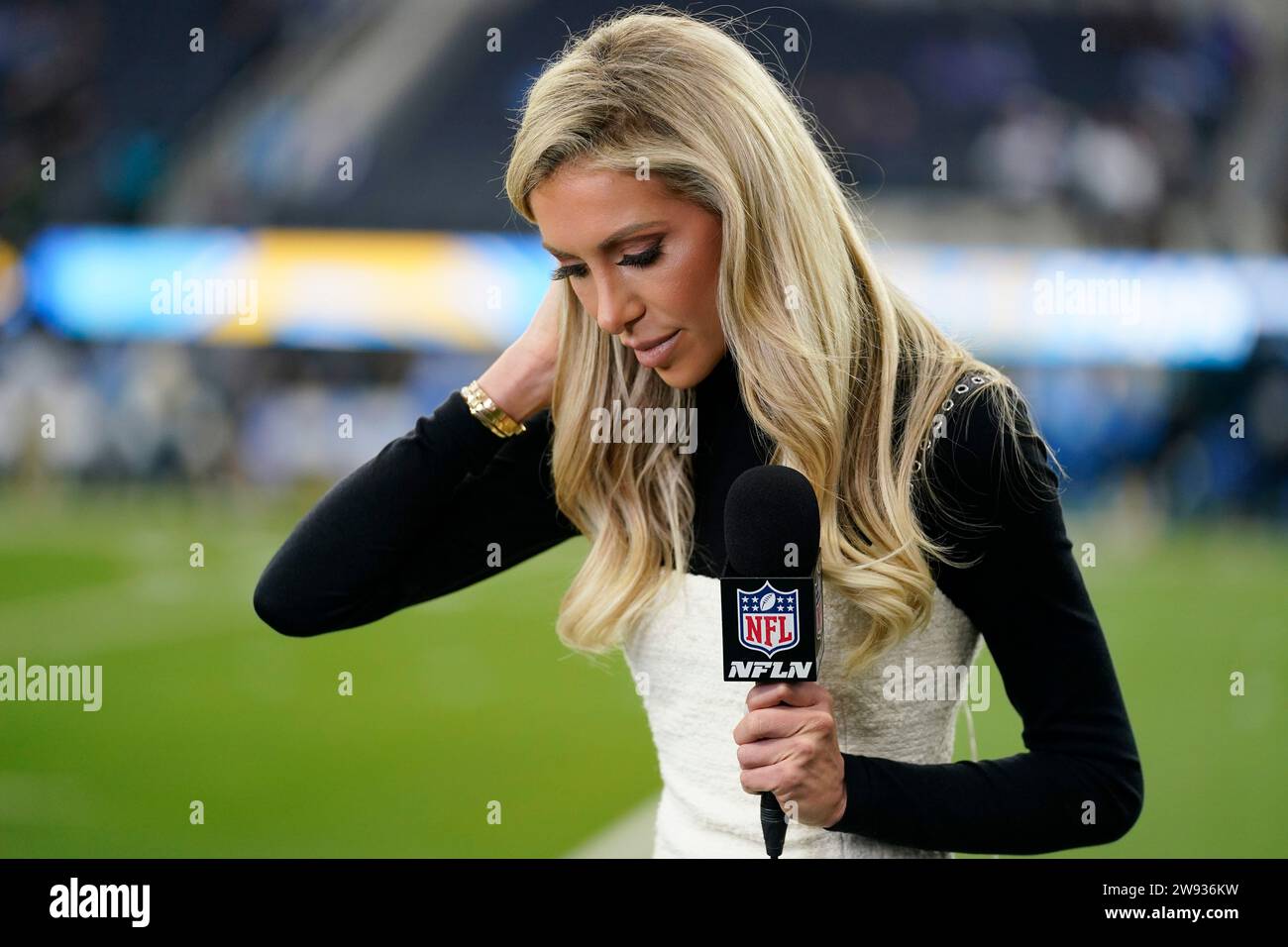 NFL Network reporter Taylor Bisciotti works on the sideline before an ...
