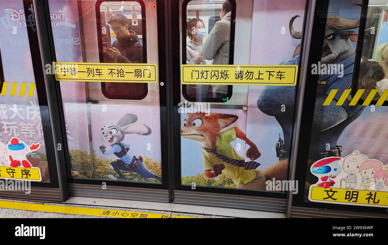 SHANGHAI, CHINA - DECEMBER 21, 2023 - Visitors ride the Disneyland ...