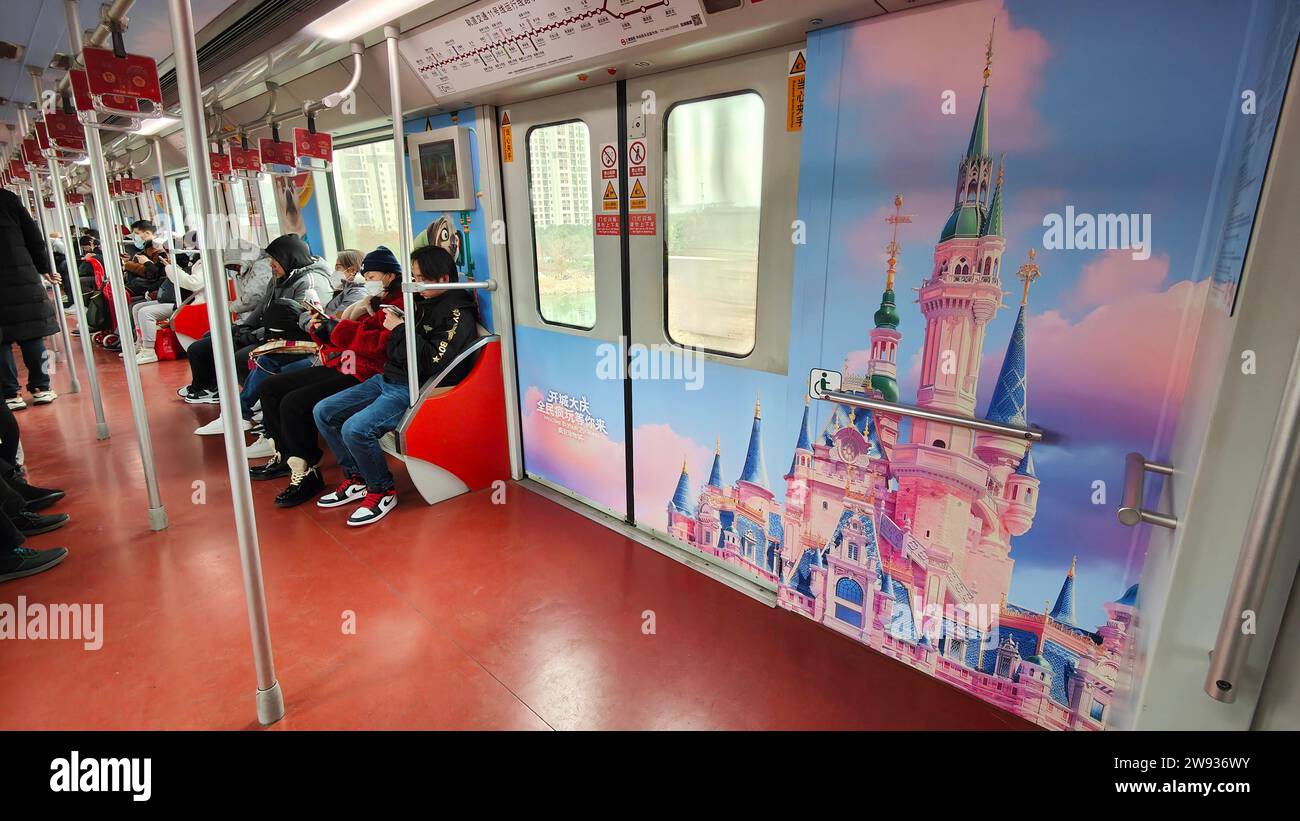 SHANGHAI, CHINA - DECEMBER 21, 2023 - Visitors ride the Disneyland ...