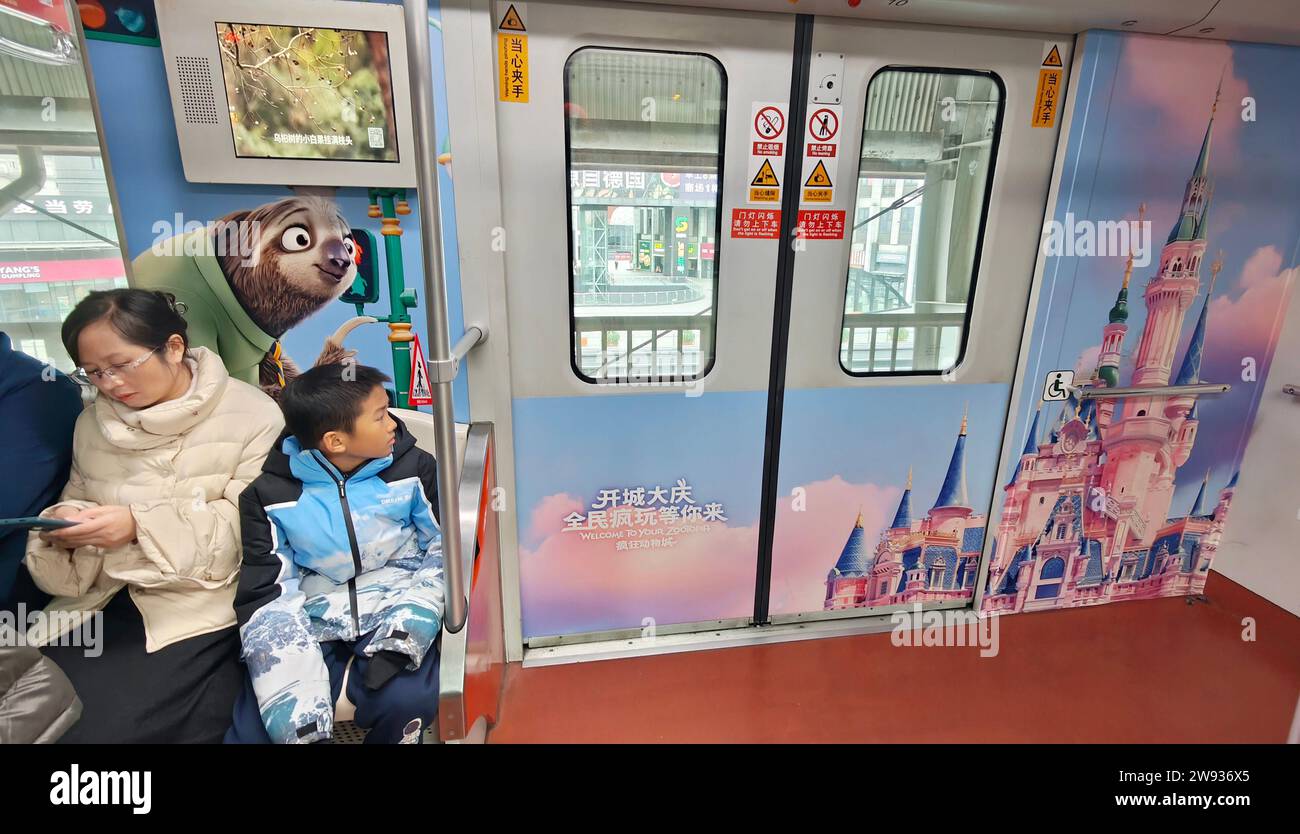 SHANGHAI, CHINA - DECEMBER 21, 2023 - Visitors ride the Disneyland ...