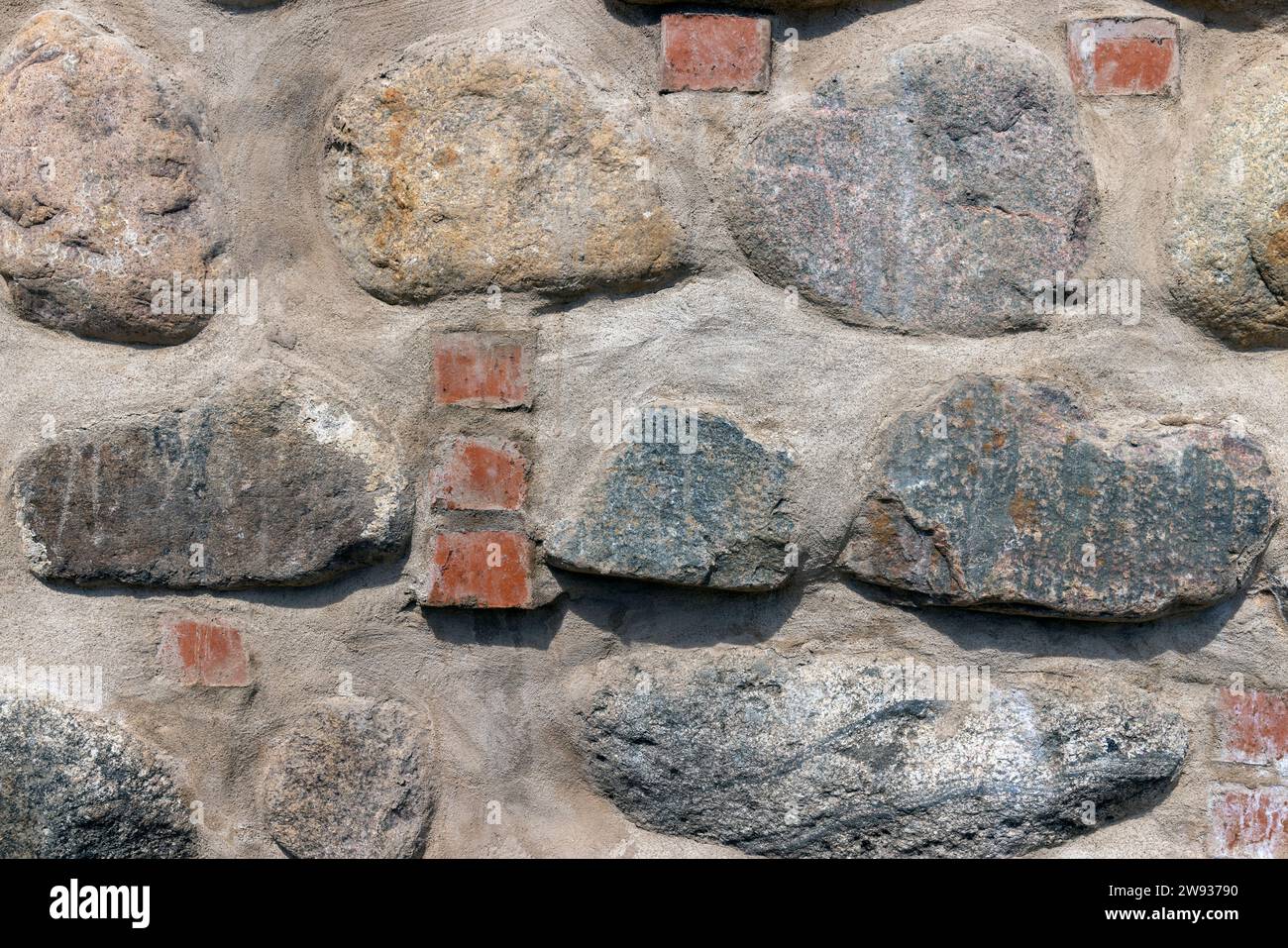 ancient wall of cobblestones and red bricks, combined ancient wall of ...